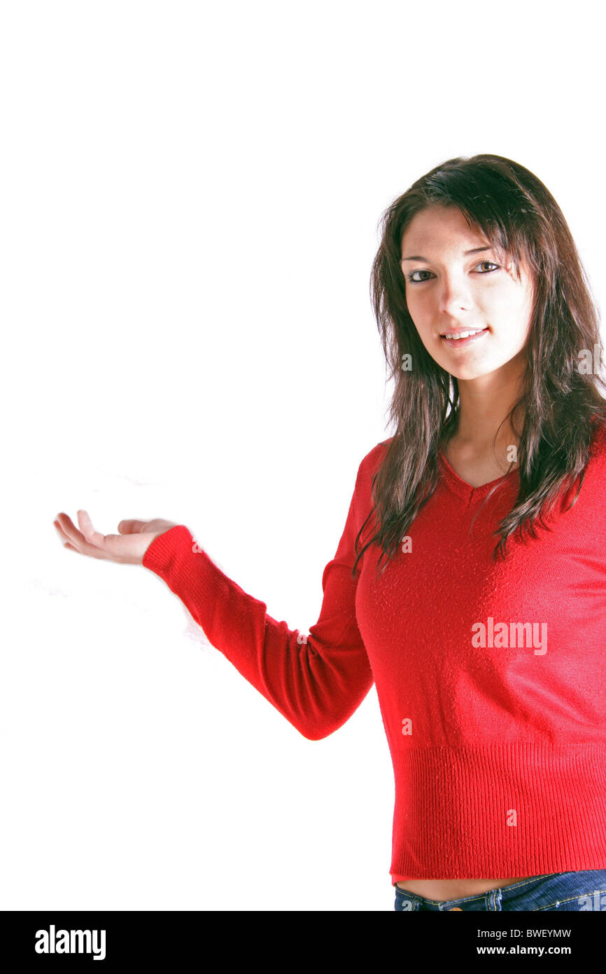 Attractive young woman pointing to the side. All on white background ...