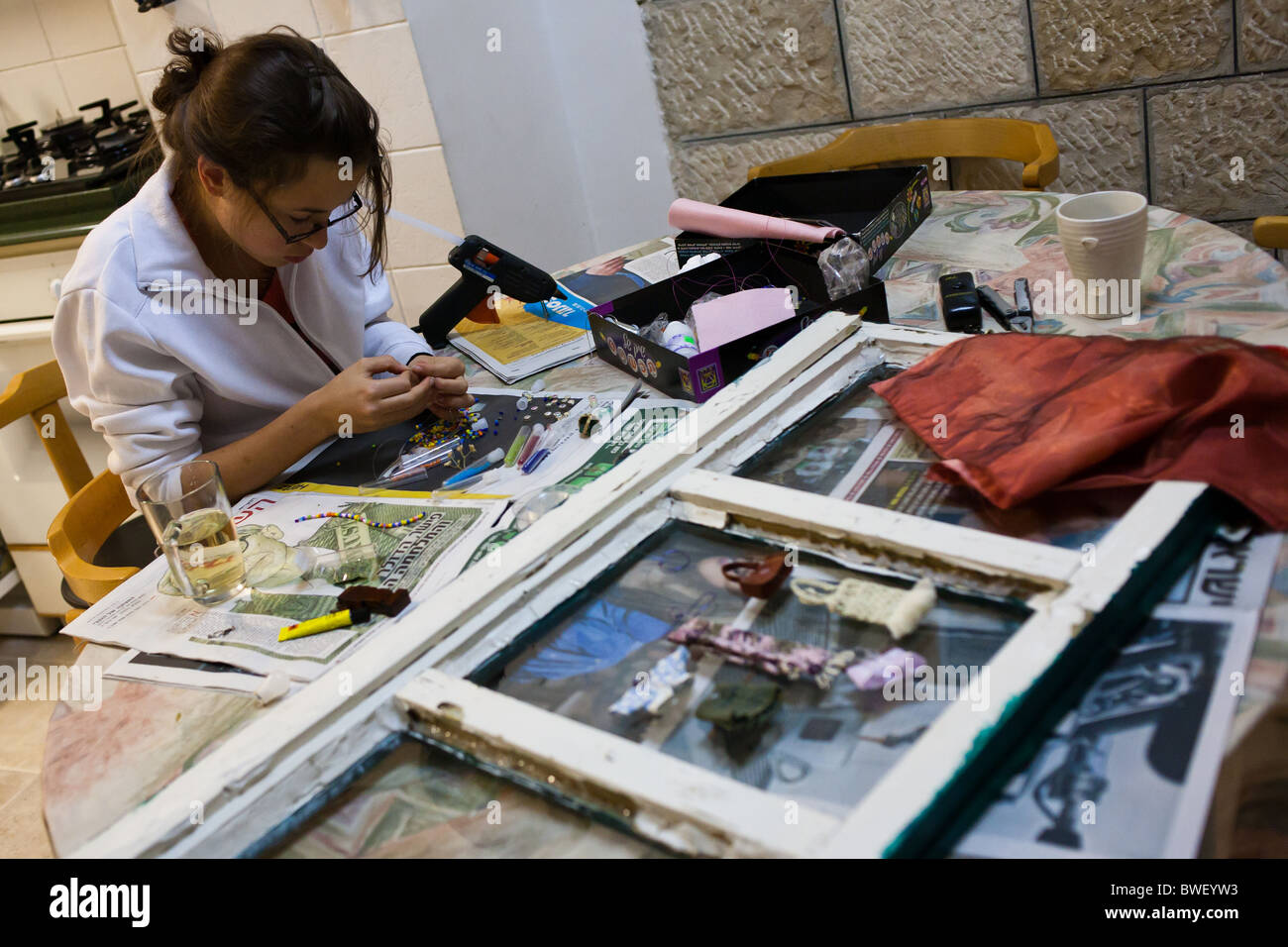 Teenage young woman engaging in arts and crafts Stock Photo - Alamy
