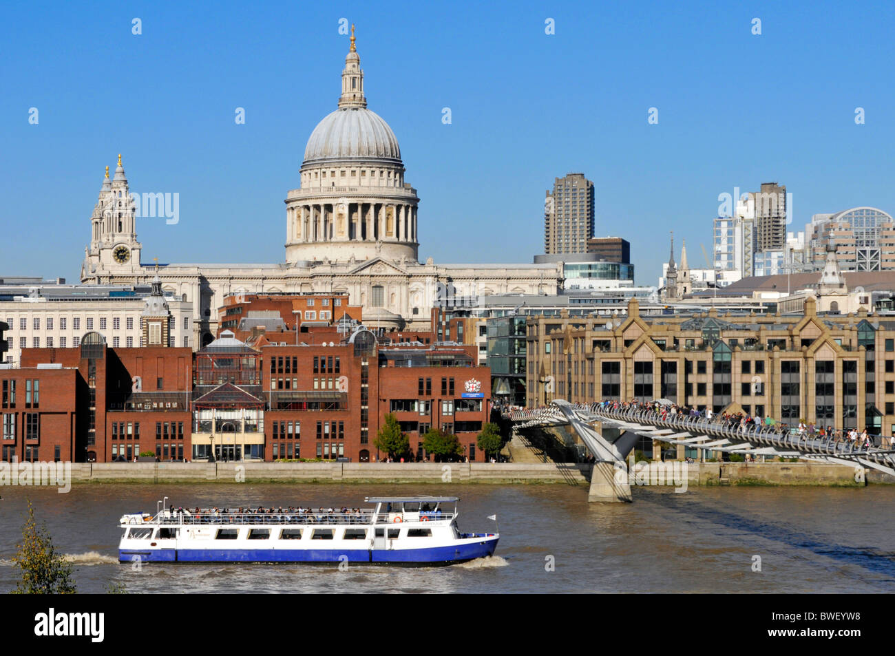 Blue sky day in City of London skyline River Thames at high tide ...