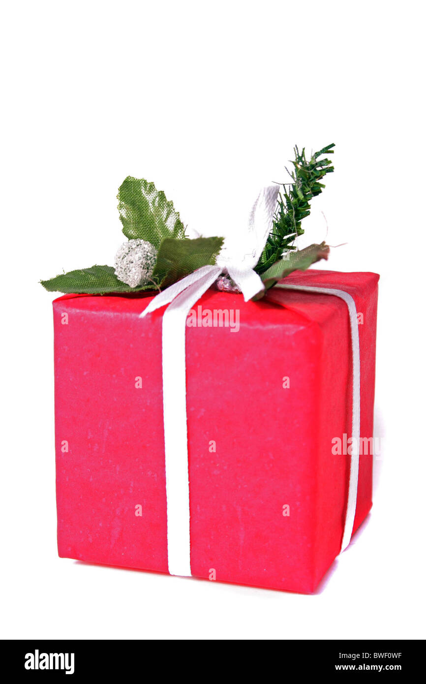 A small red present. All isolated on white background Stock Photo - Alamy