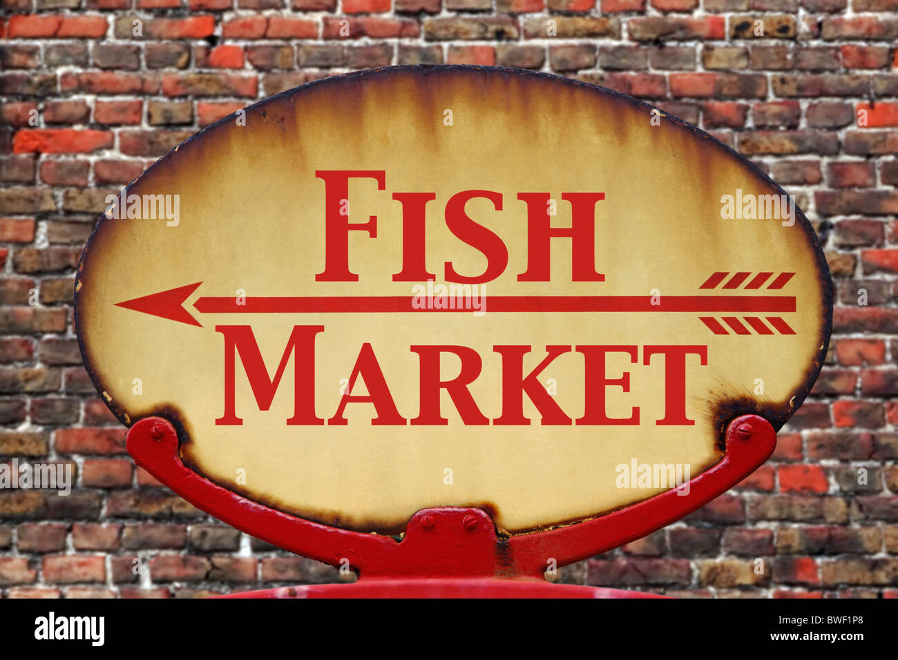 A rusty old retro arrow sign with the text Fish Market Stock Photo - Alamy