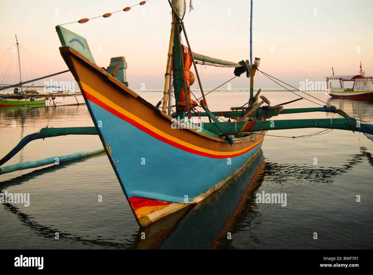 A Balinese fishing boat, called a Jukung, is a dugout outrigger canoe ...