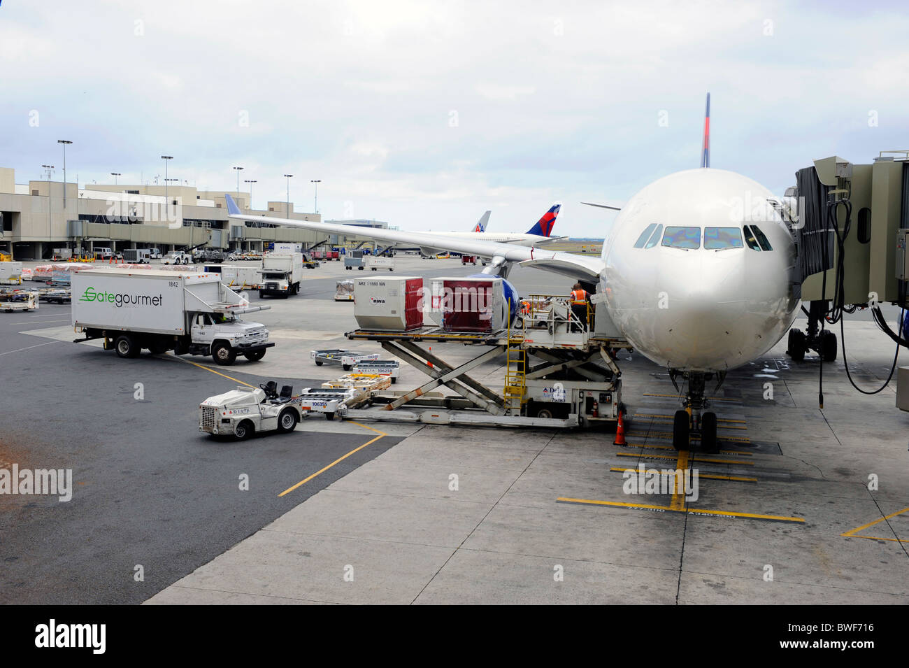 Jet airplane being loaded with food and supplies before flight Stock ...