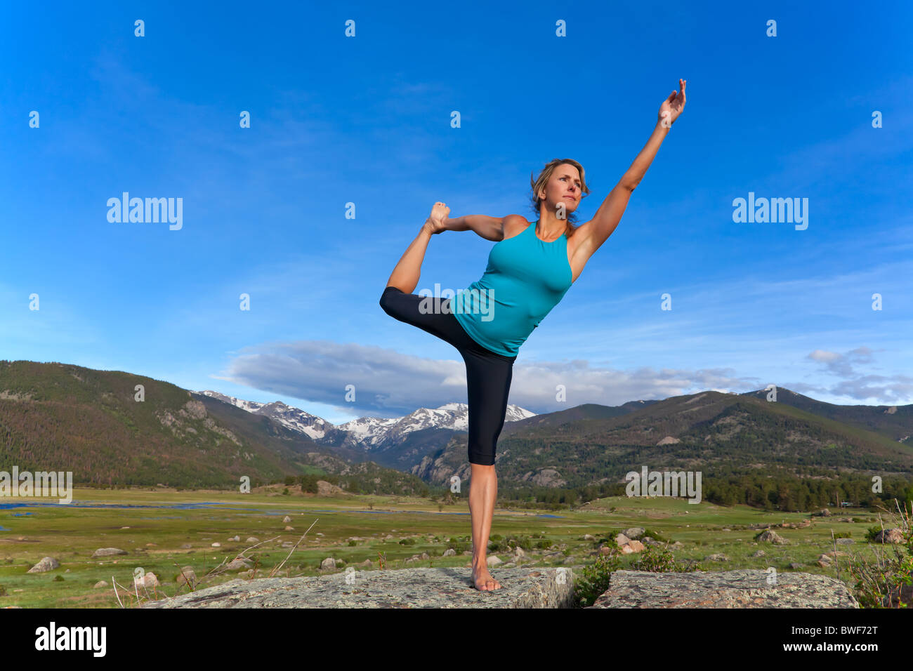 A woman practices Yoga in the mountains of Colorado Stock Photo - Alamy