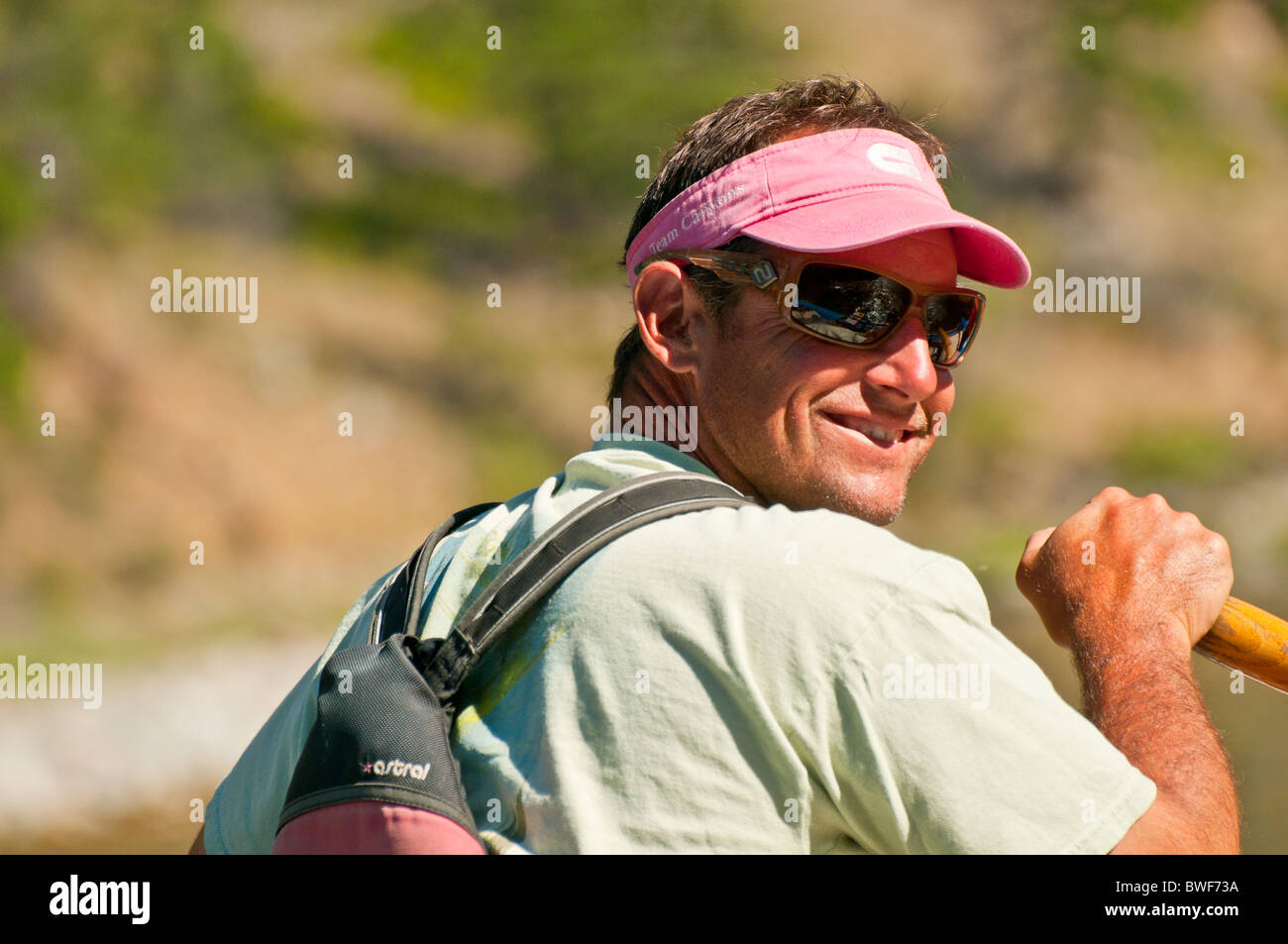 USA, Idaho, Male Rafting Guide rowing raft on the the Middle fork of ...