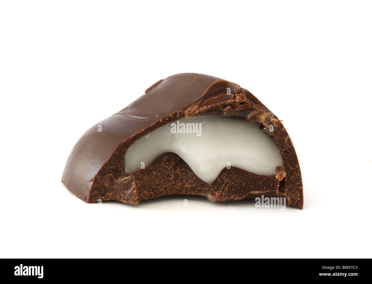 Dark chocolate candy - praline with menthol filling - close up view on ...