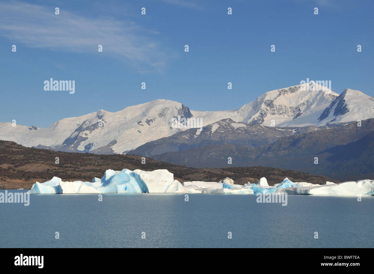 Blue, white ice-bergs reflecting in the waters of Lake Argentino ...