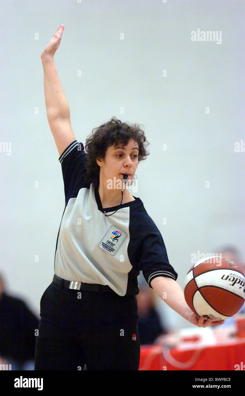 A basketball referee at the start of a game Stock Photo - Alamy