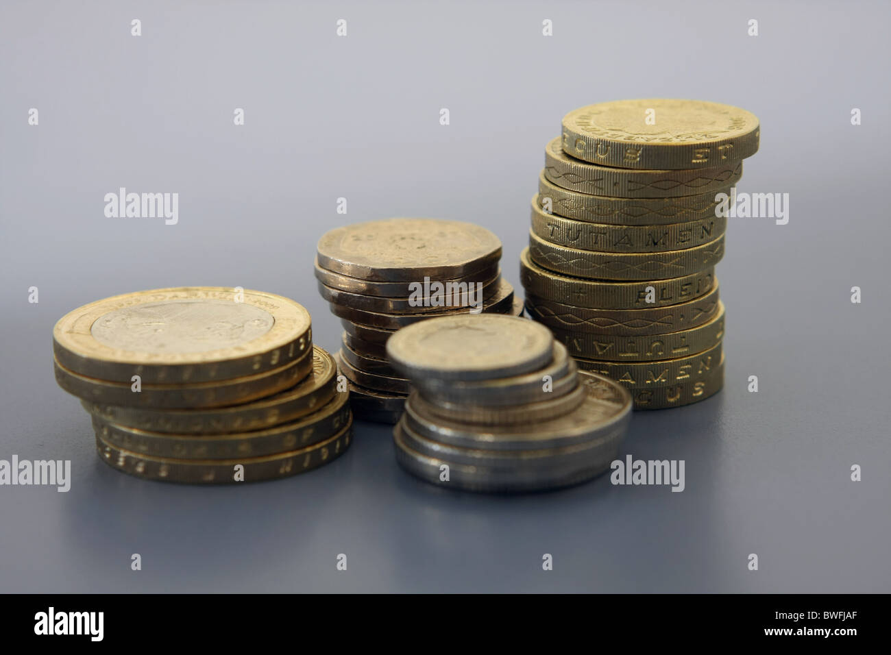 Stacks of £2, £1, 20p with a stack of 5p on 10p coins Stock Photo - Alamy