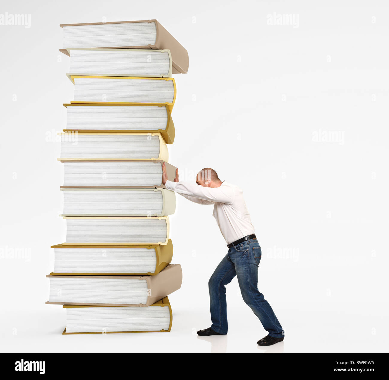 man try to push book pile on white background Stock Photo - Alamy