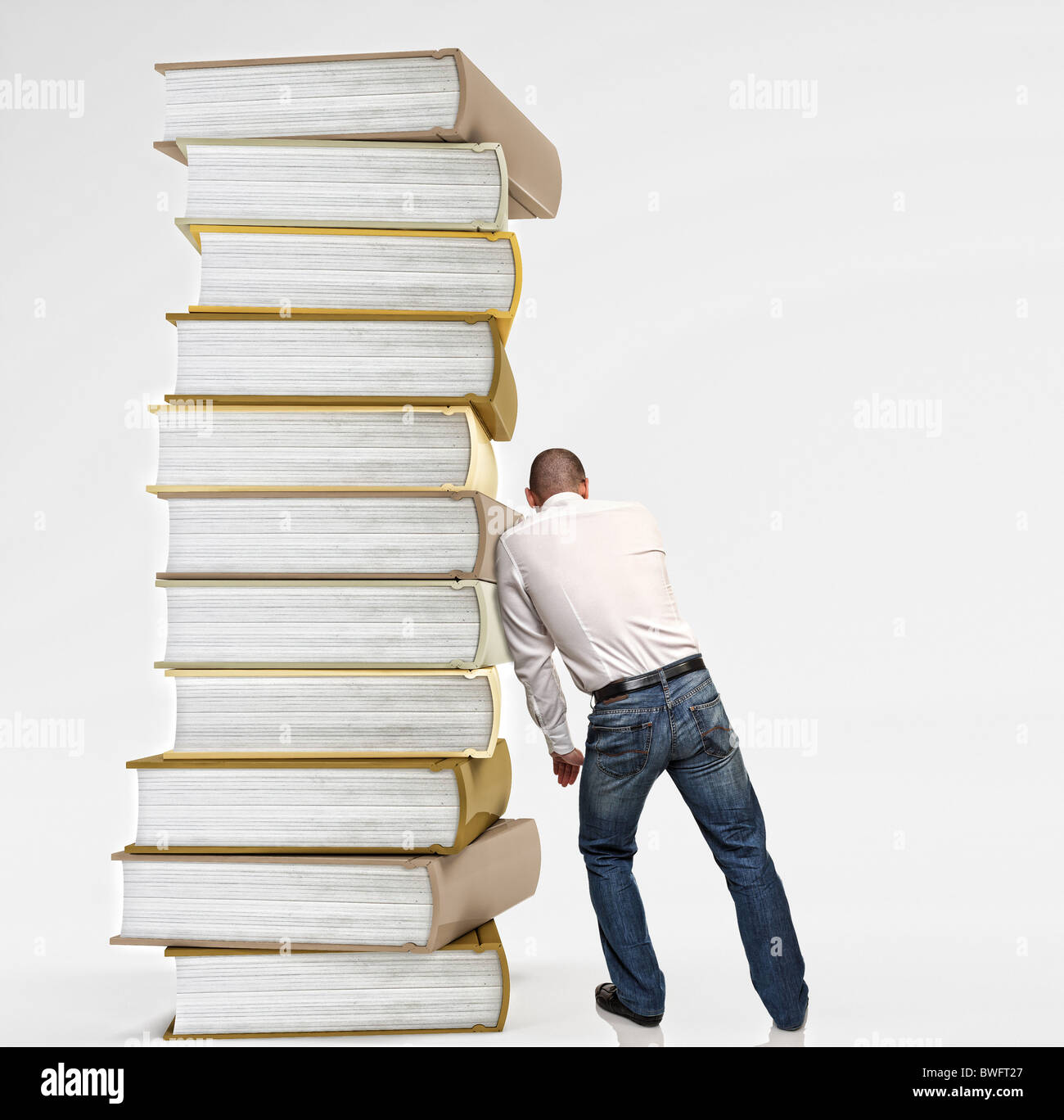 man push book pile on white background Stock Photo - Alamy