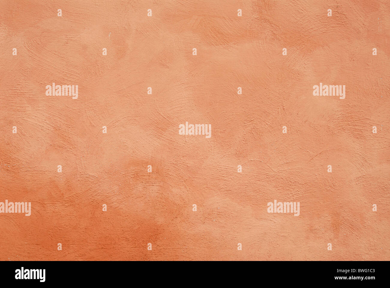 close up detail of rustic textured terracotta stucco wall Stock Photo ...