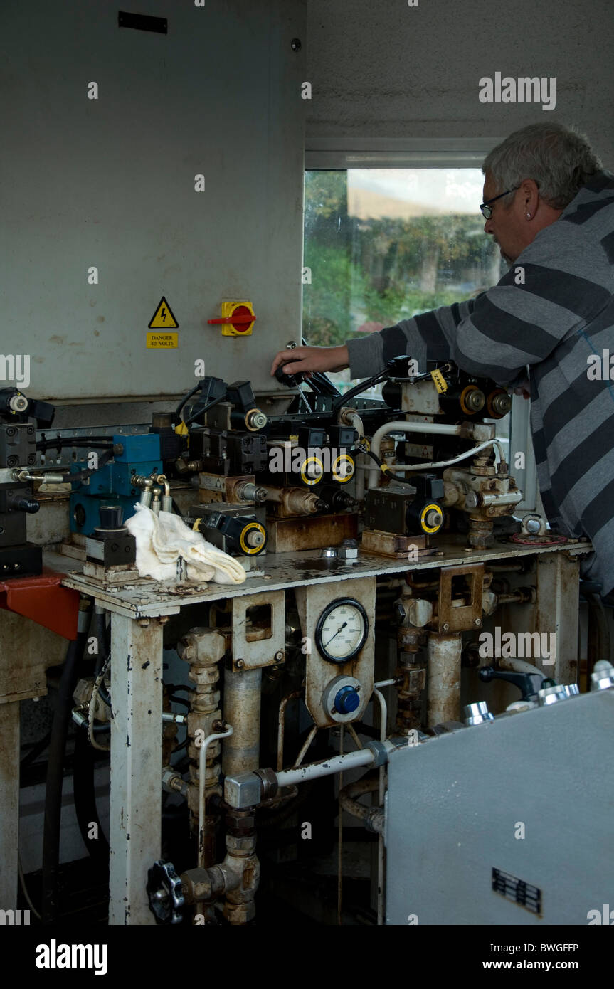 Swing bridge operator at Caernarfon, North Wales Stock Photo - Alamy