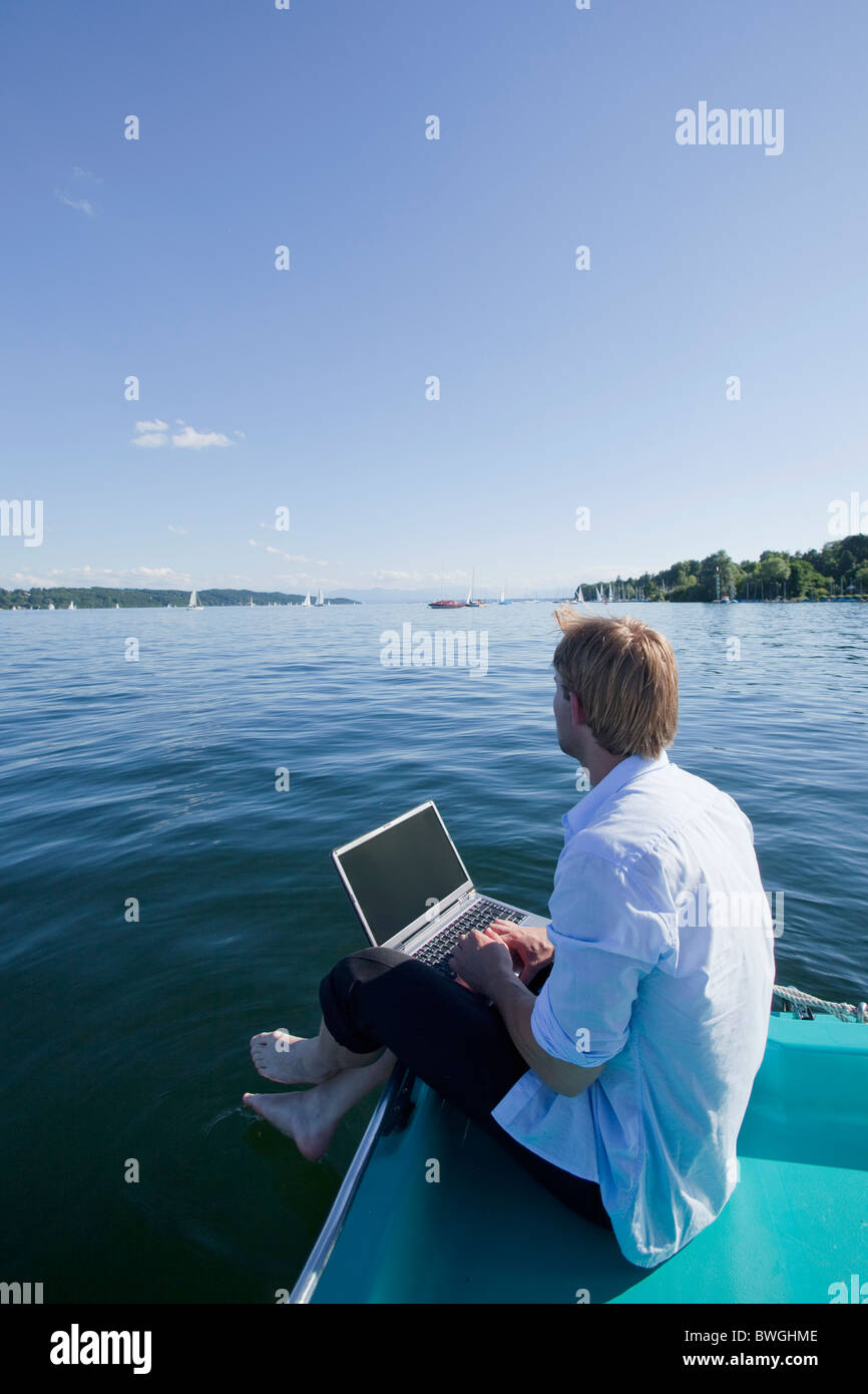 Man outdoors lake working laptop hi-res stock photography and images ...