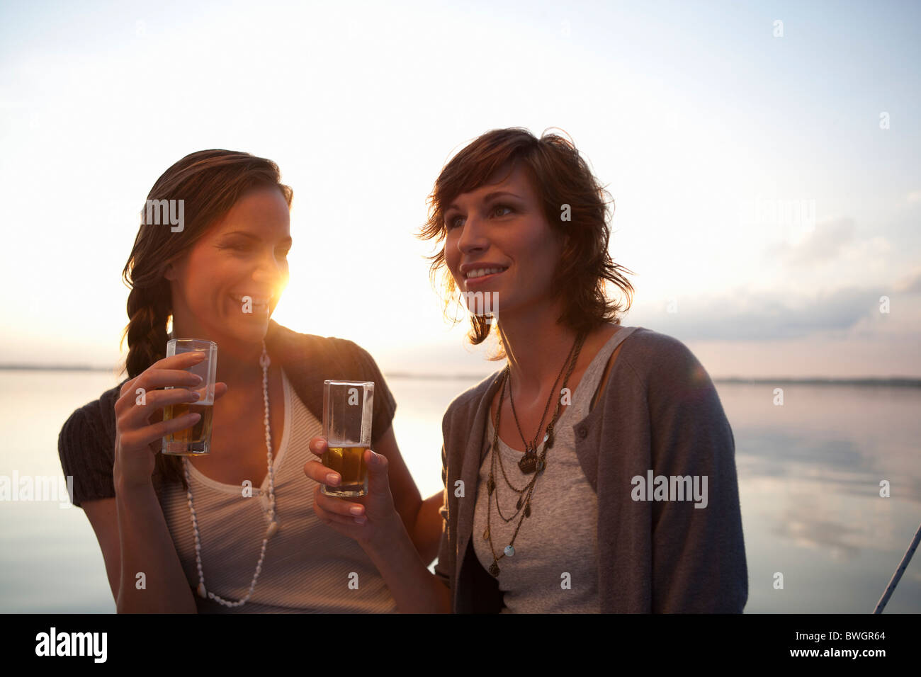 Girls drinking beer Stock Photo - Alamy