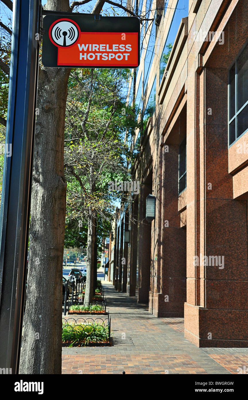 Wireless hot spot sign in downtown area of city Stock Photo - Alamy