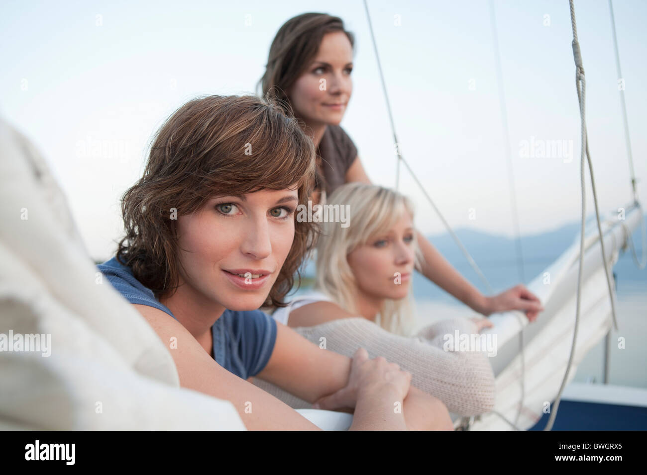 Girls standing on sail Stock Photo - Alamy