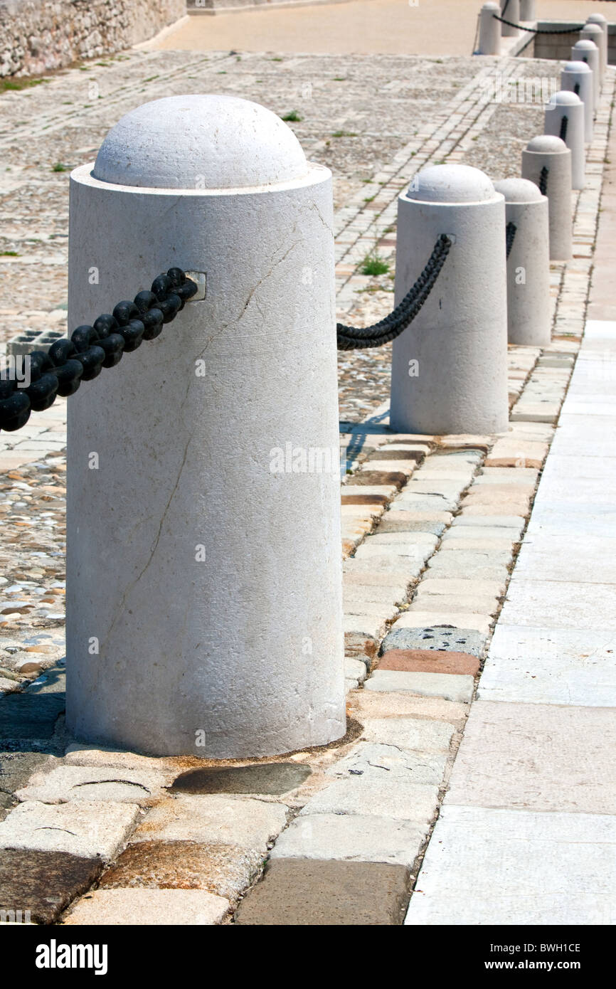 stone post fence in perspective. vertical shot Stock Photo - Alamy
