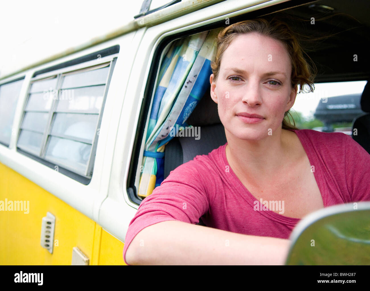 Women at the wheel of a camper van Stock Photo - Alamy