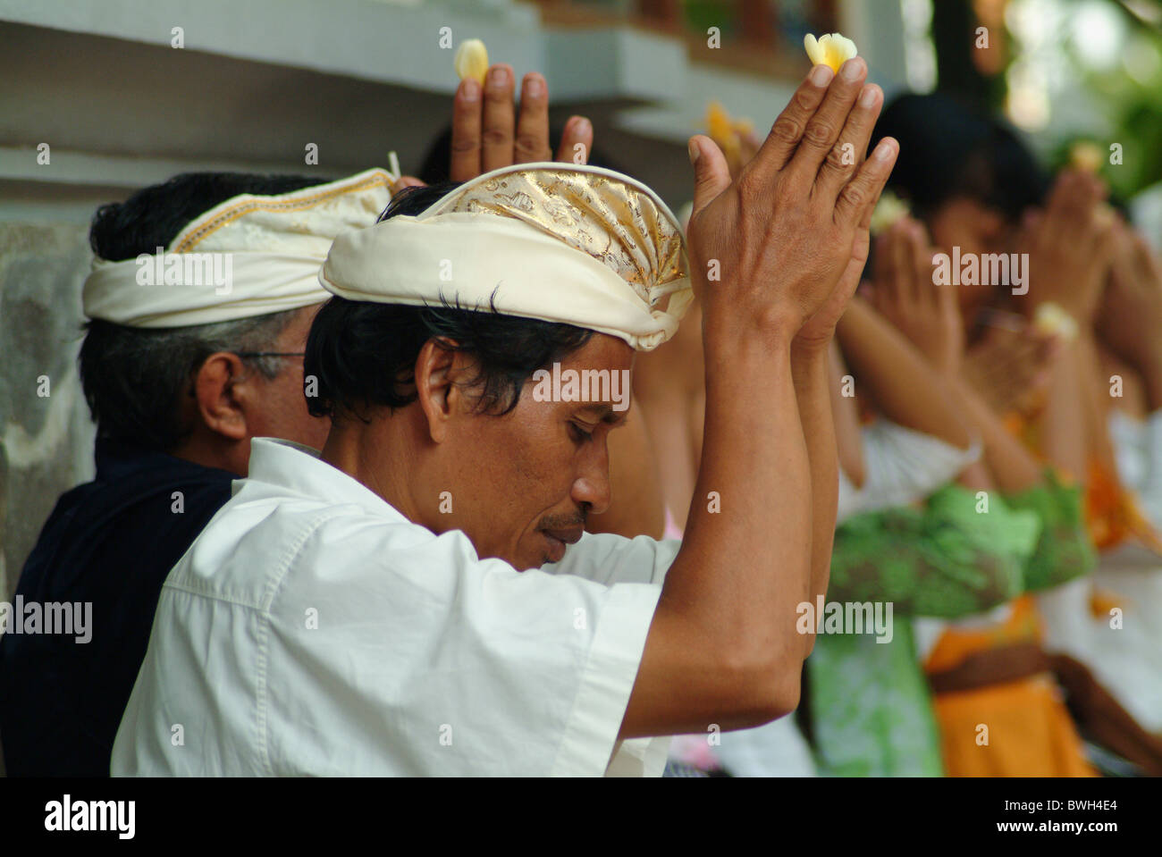At a temple in Ubud, Bali, Hindu followers pray during a day called ...