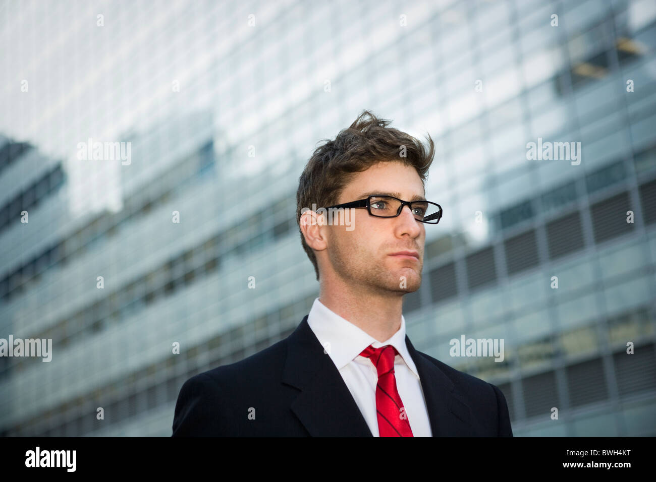 Man standing by building Stock Photo - Alamy