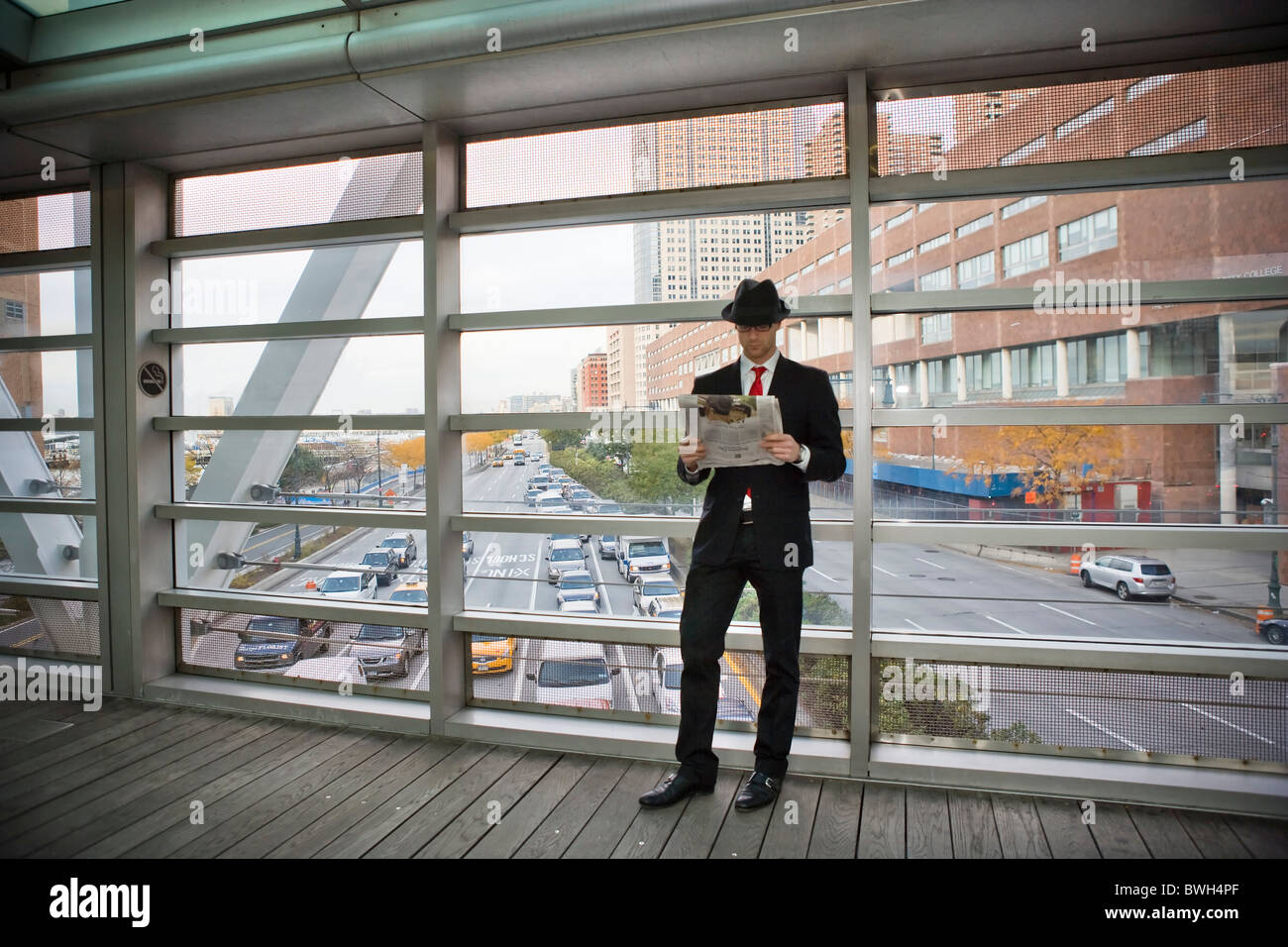 Man standing on bridge Stock Photo - Alamy