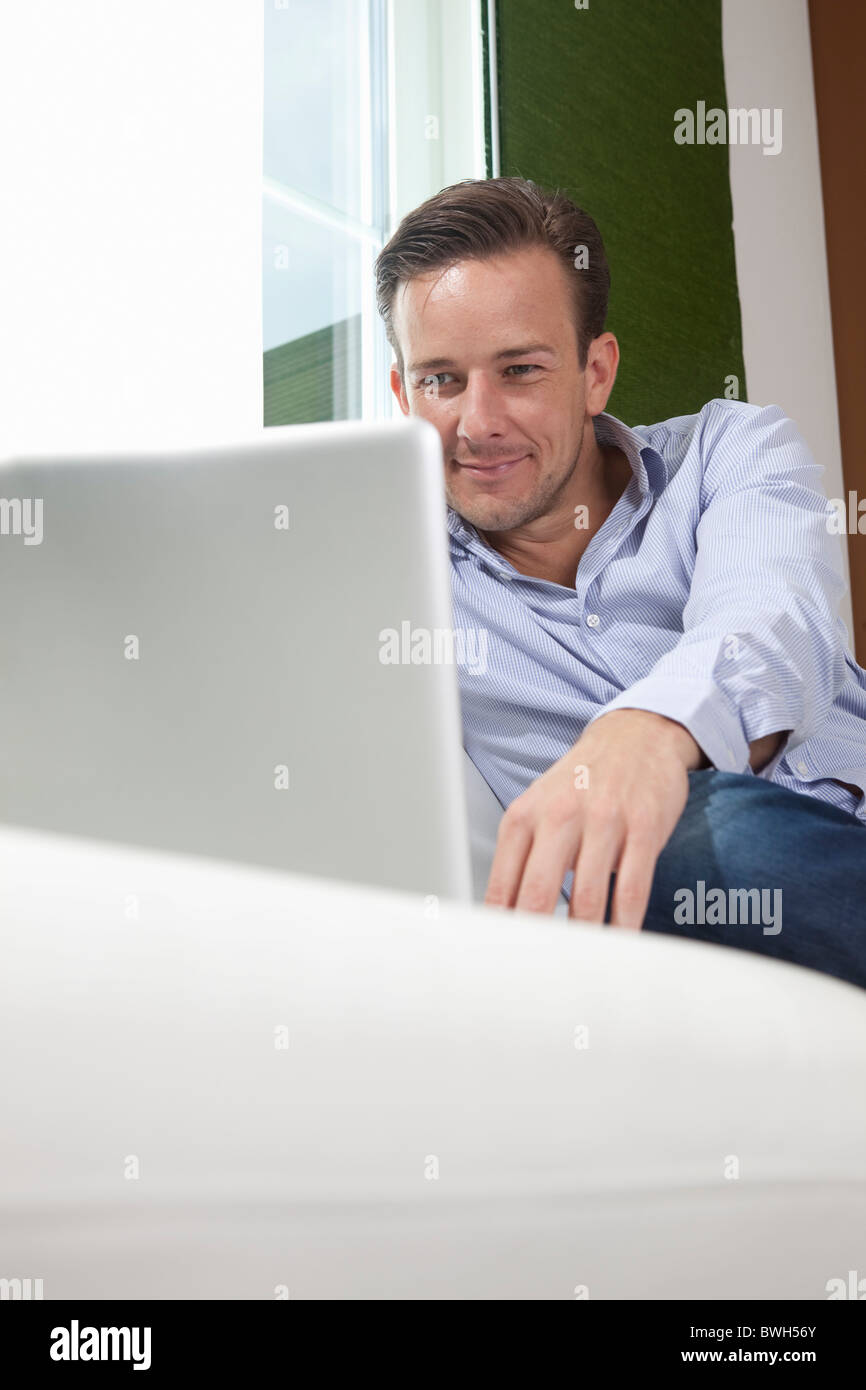 Man emailing home hi-res stock photography and images - Alamy