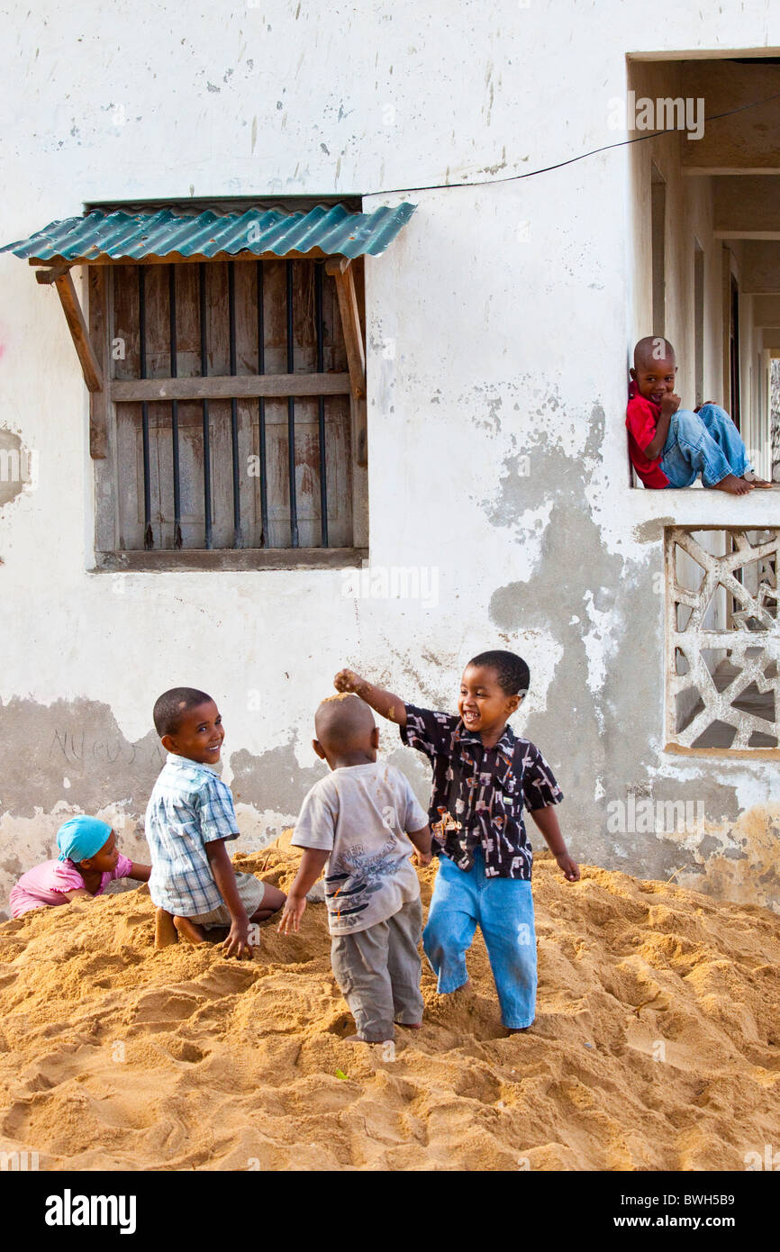 Children playing in sand on Lamu Island, Kenya Stock Photo - Alamy