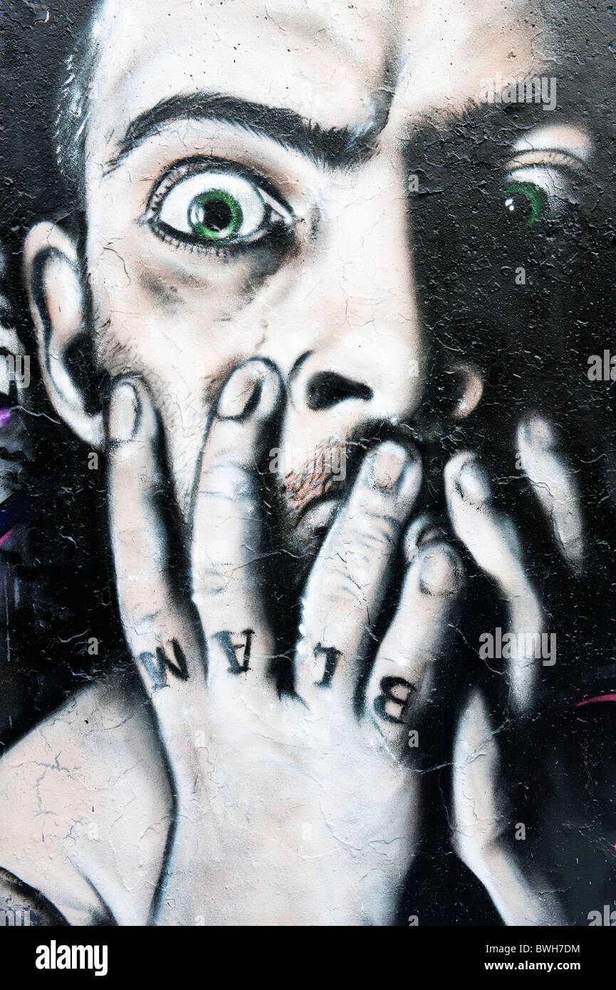 graffiti scared face on wall Stock Photo - Alamy
