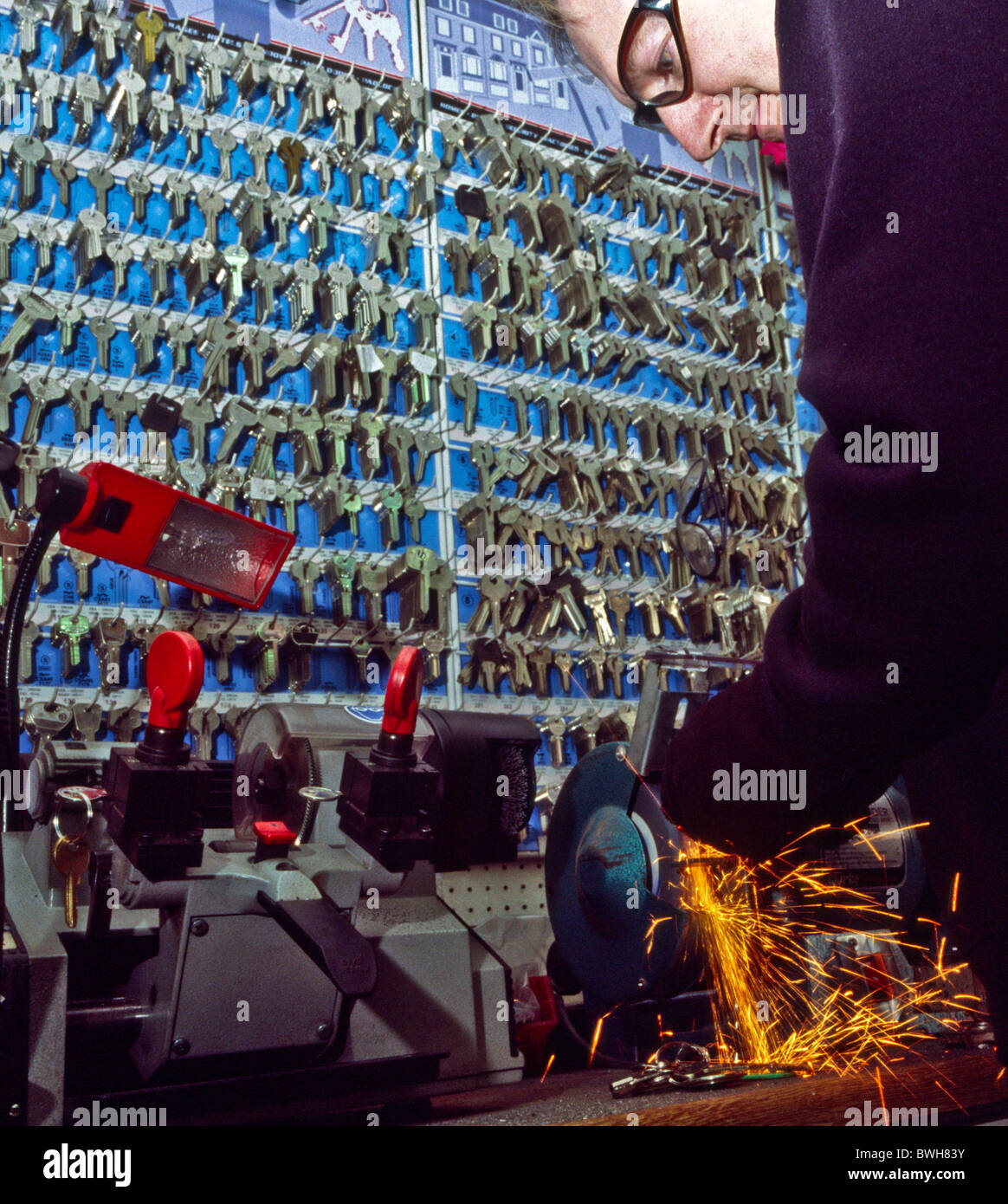 A Key cutter creating lots of sparks grinding a key Stock Photo - Alamy