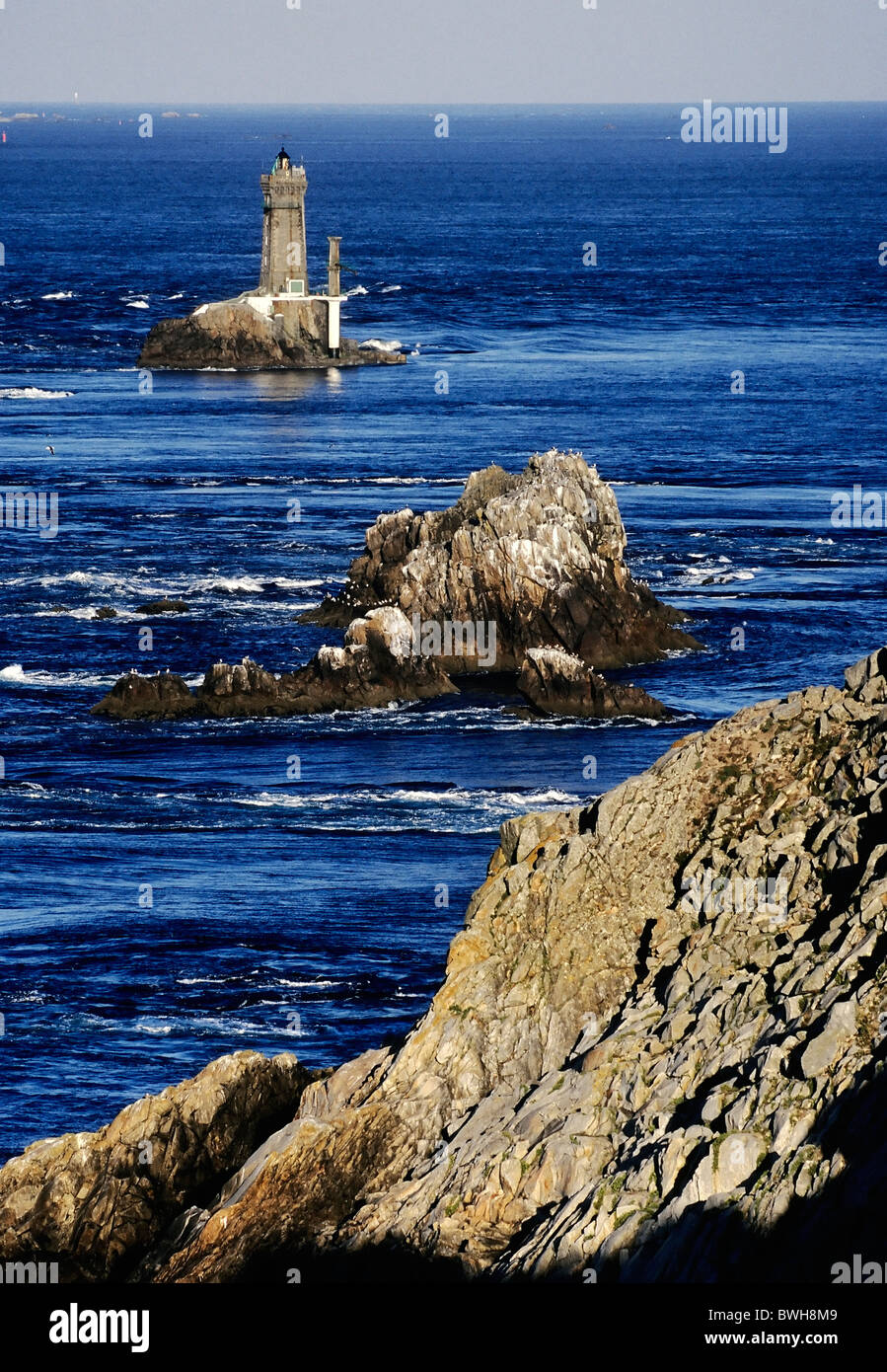 View from the Pointe du Raz on rocks and lighthouse, Finistere ...