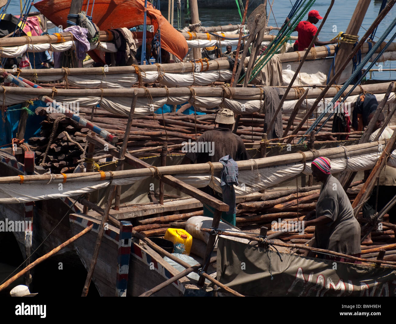 hive of activity as stevedore porters busy themselves unloading poles ...