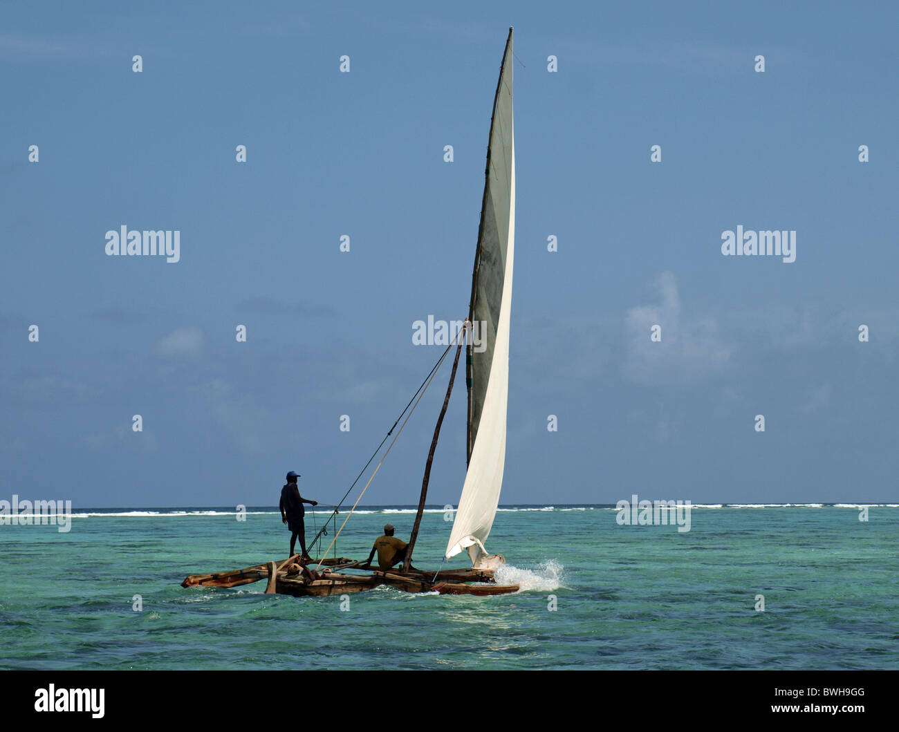local outrigger fishing boat or ngalawa (dhow) sailing off Matemwe ...