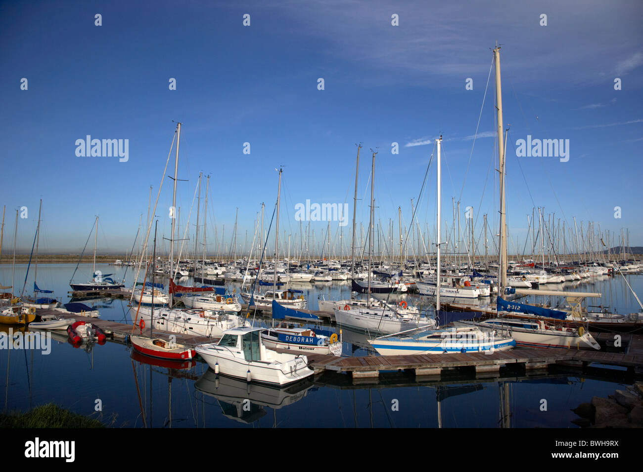 yachts and boats in the royal irish yacht club in howth harbour and ...