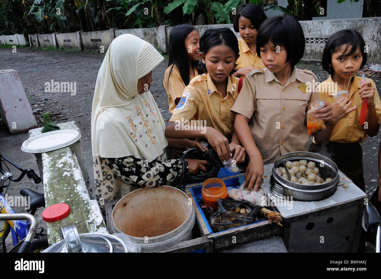 Pupils in school uniform during the break in front of the school at a ...