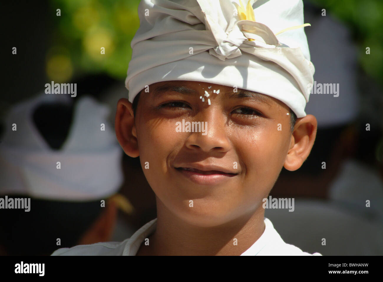 A smiling Bali young man in the village of Ubud, Bali in his ...