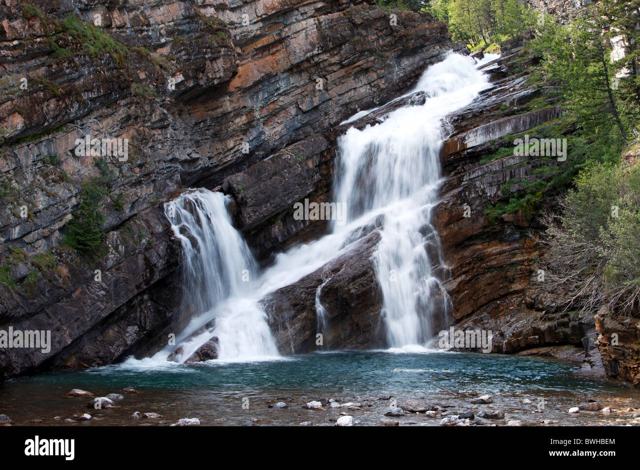 Beautiful Cameron Falls in Waterton, Canada cascading into a pool of ...