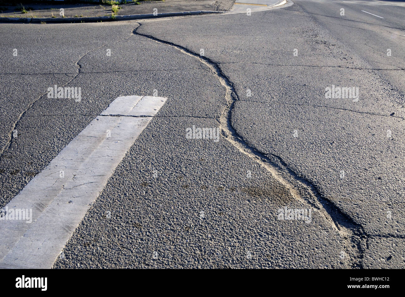 Crack in Pavement on City Street Stock Photo - Alamy