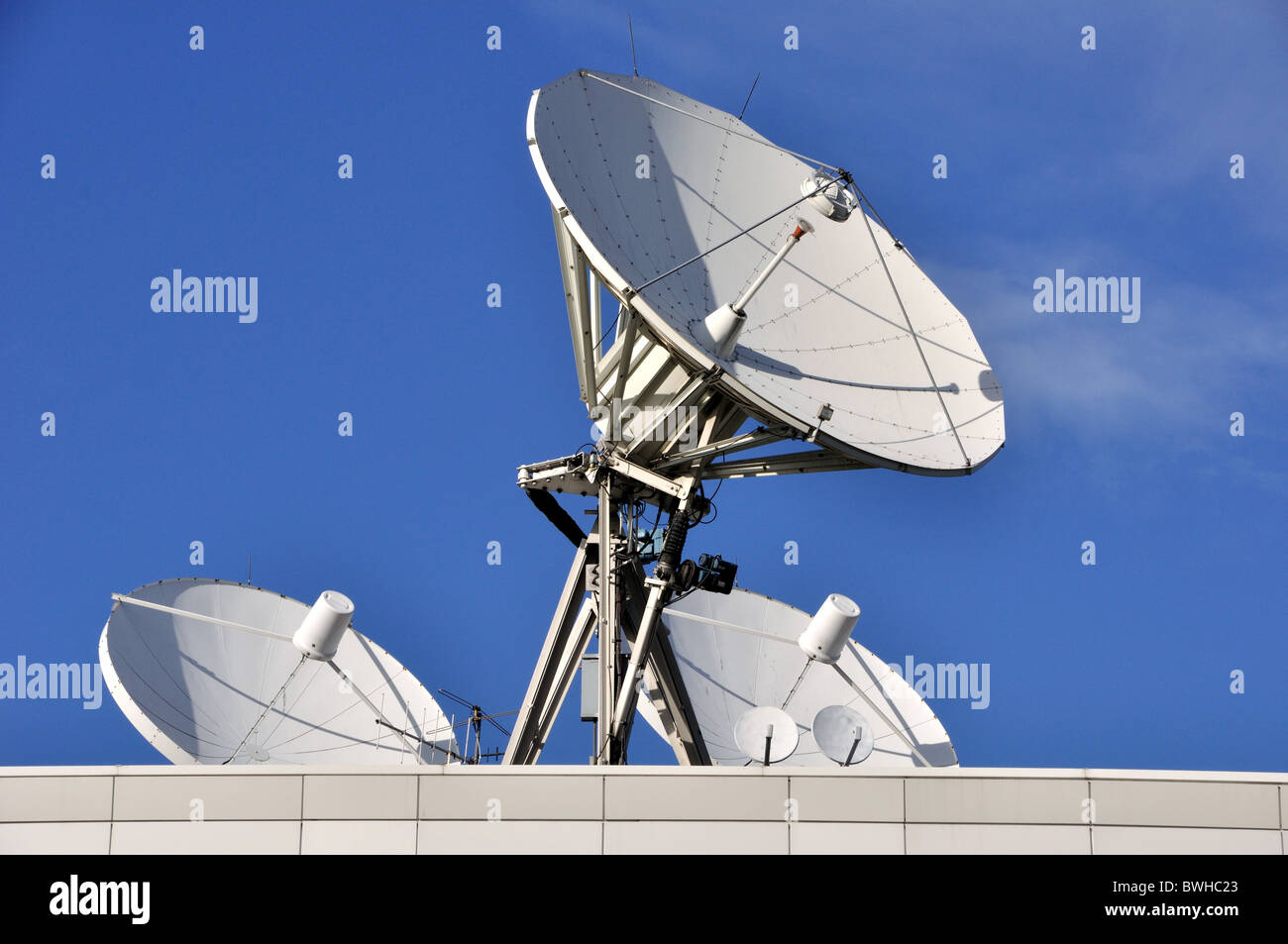 Satellite Communications Dishes on a Roof Stock Photo - Alamy