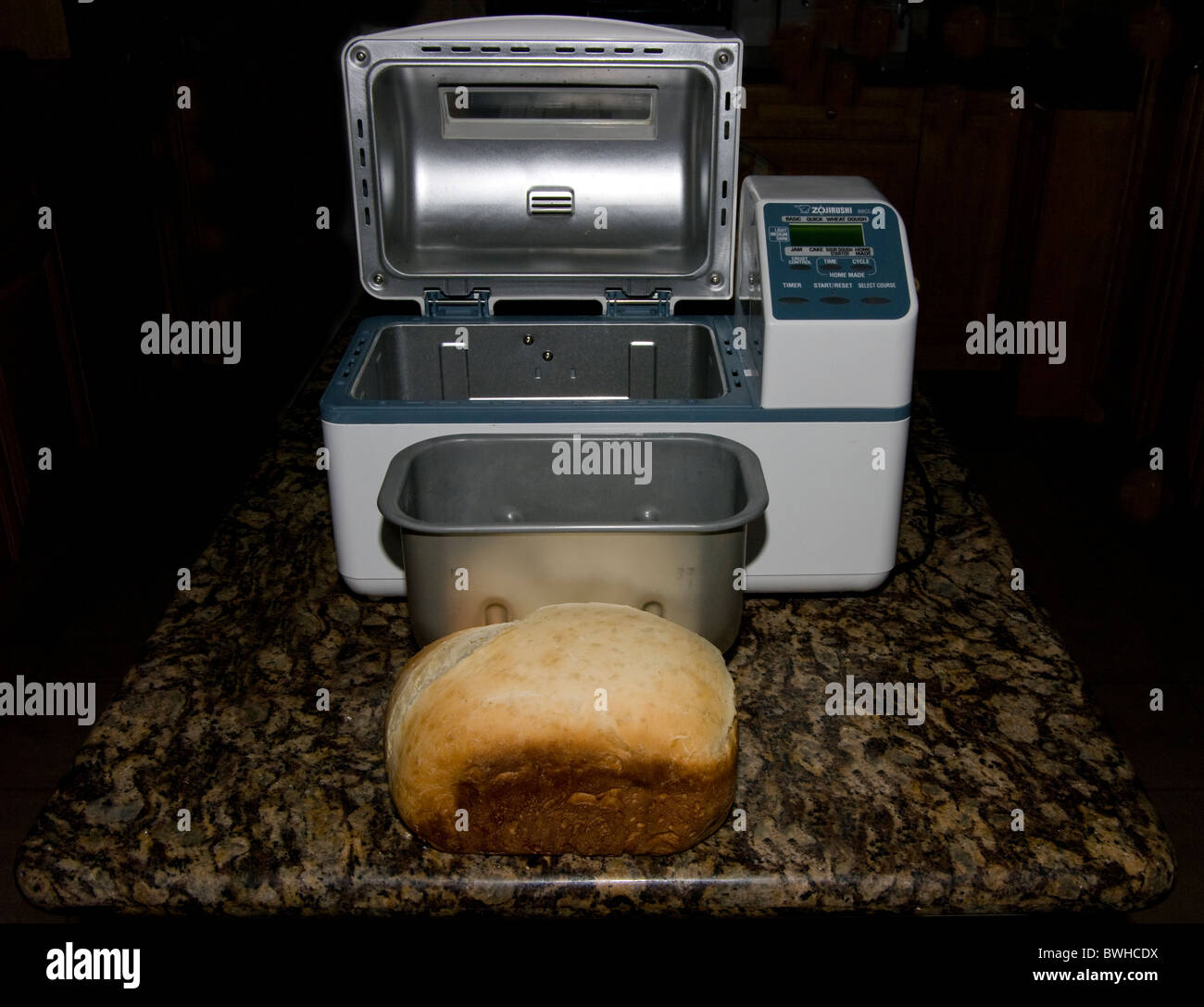 Bread maker with loaf pan and a fresh loaf of bread Stock Photo - Alamy
