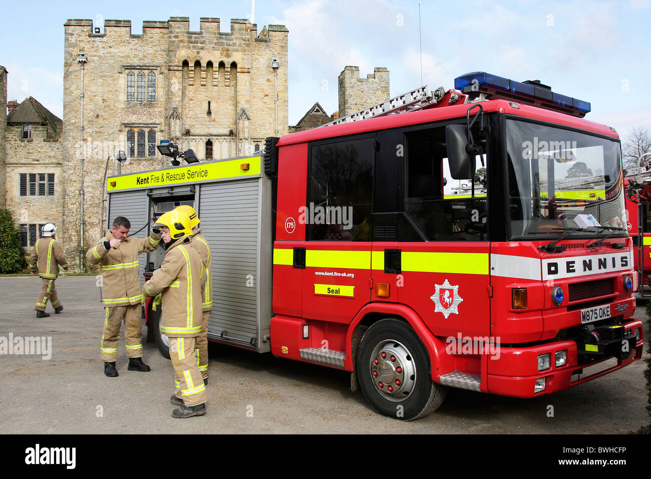 Kent fire crews carrying a drill Stock Photo - Alamy