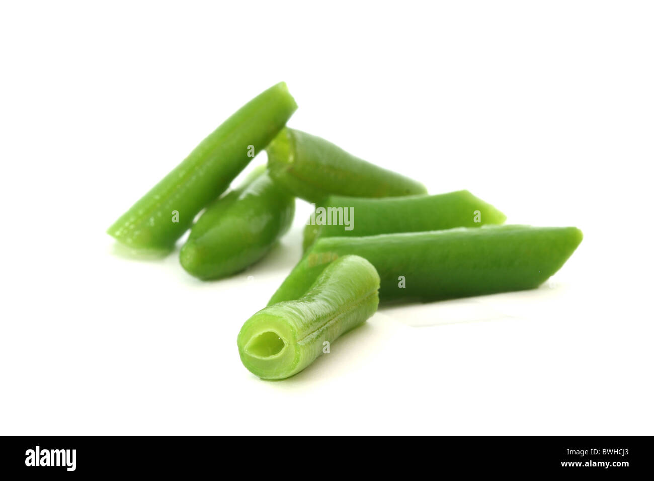 Several small green bean pods on white background - close up view Stock ...