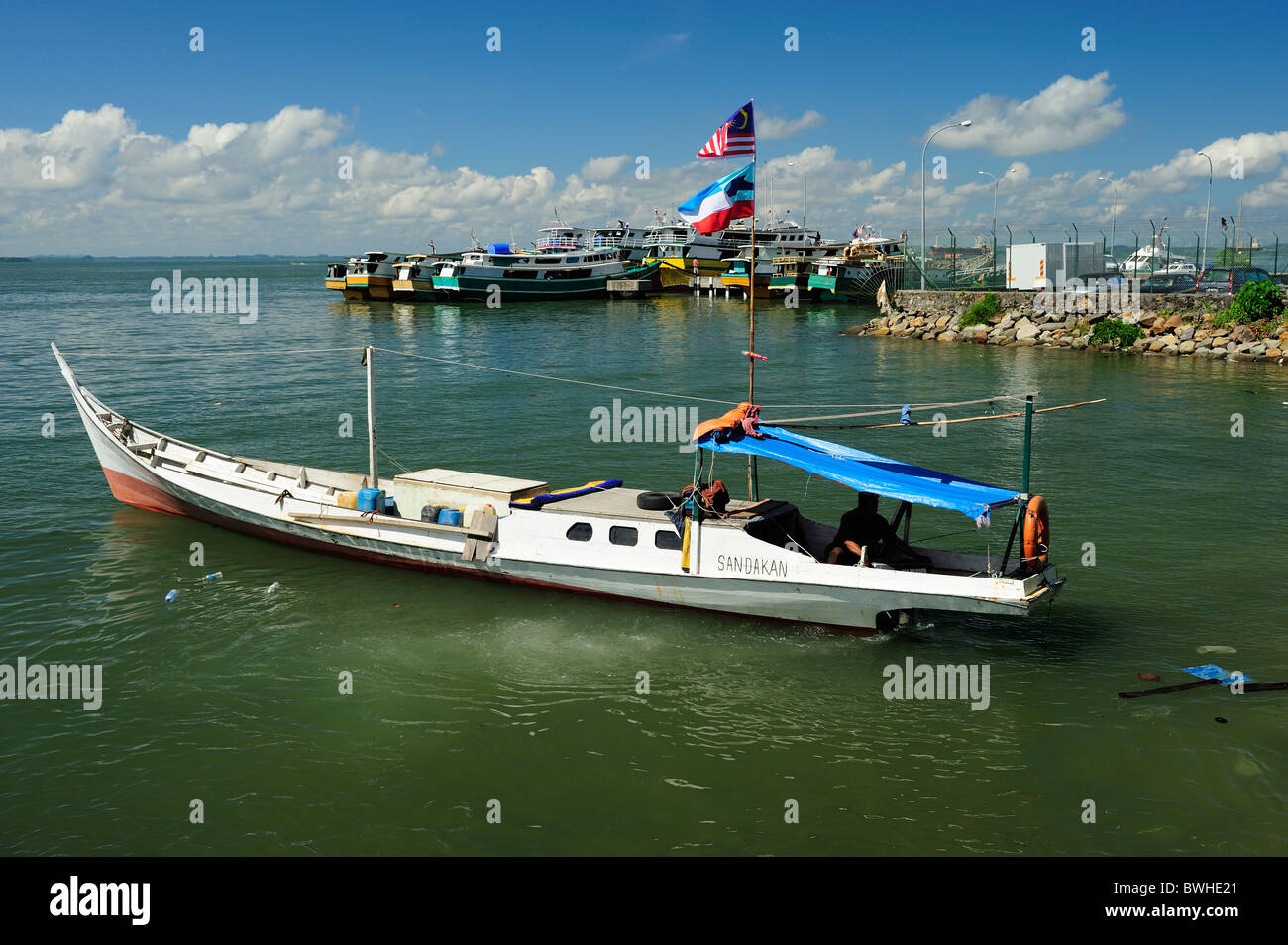Small fishing boat on waterfront in Sandakan in north-east Sabah Stock ...