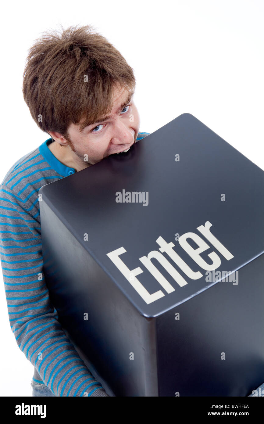 young beautiful casual man with the enter key Stock Photo - Alamy