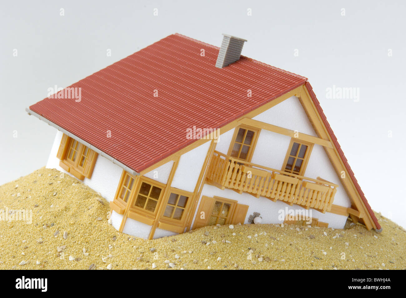 Model house built on sand Stock Photo - Alamy