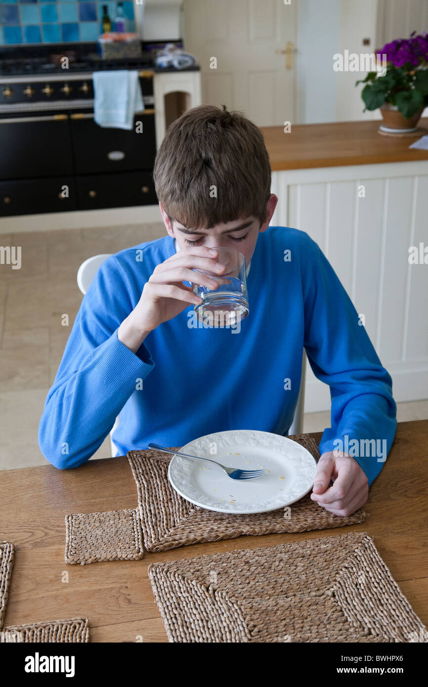 Teenager drinking water dinner hi-res stock photography and images - Alamy