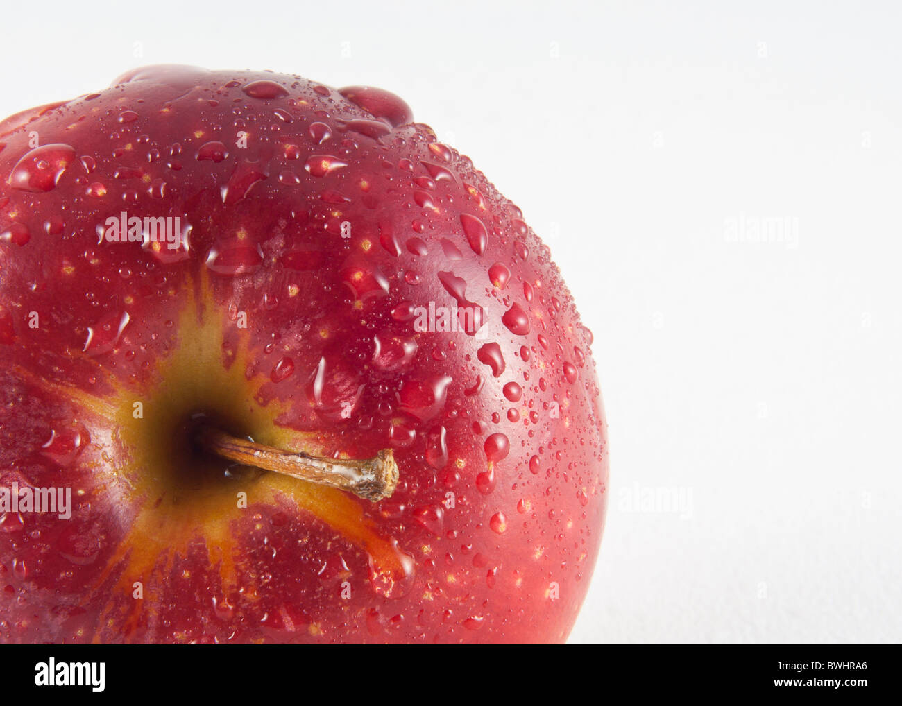 A water spotted red apple cut out against a white back-drop Stock Photo ...