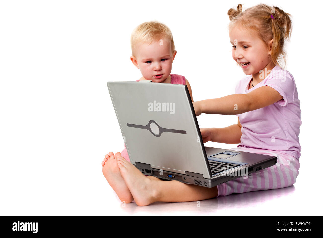 Children playing on laptop isolated on white Stock Photo - Alamy
