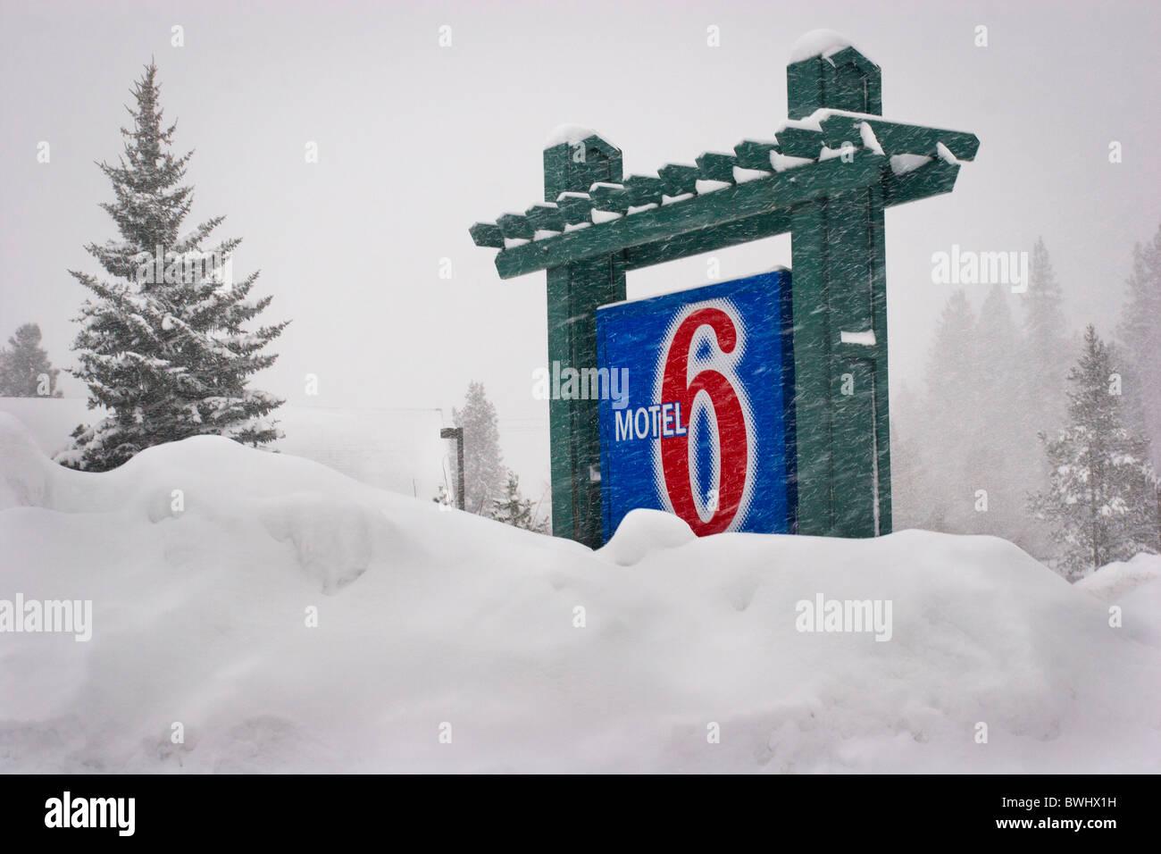 Motel 6 sign falling snow piled in front Stock Photo - Alamy