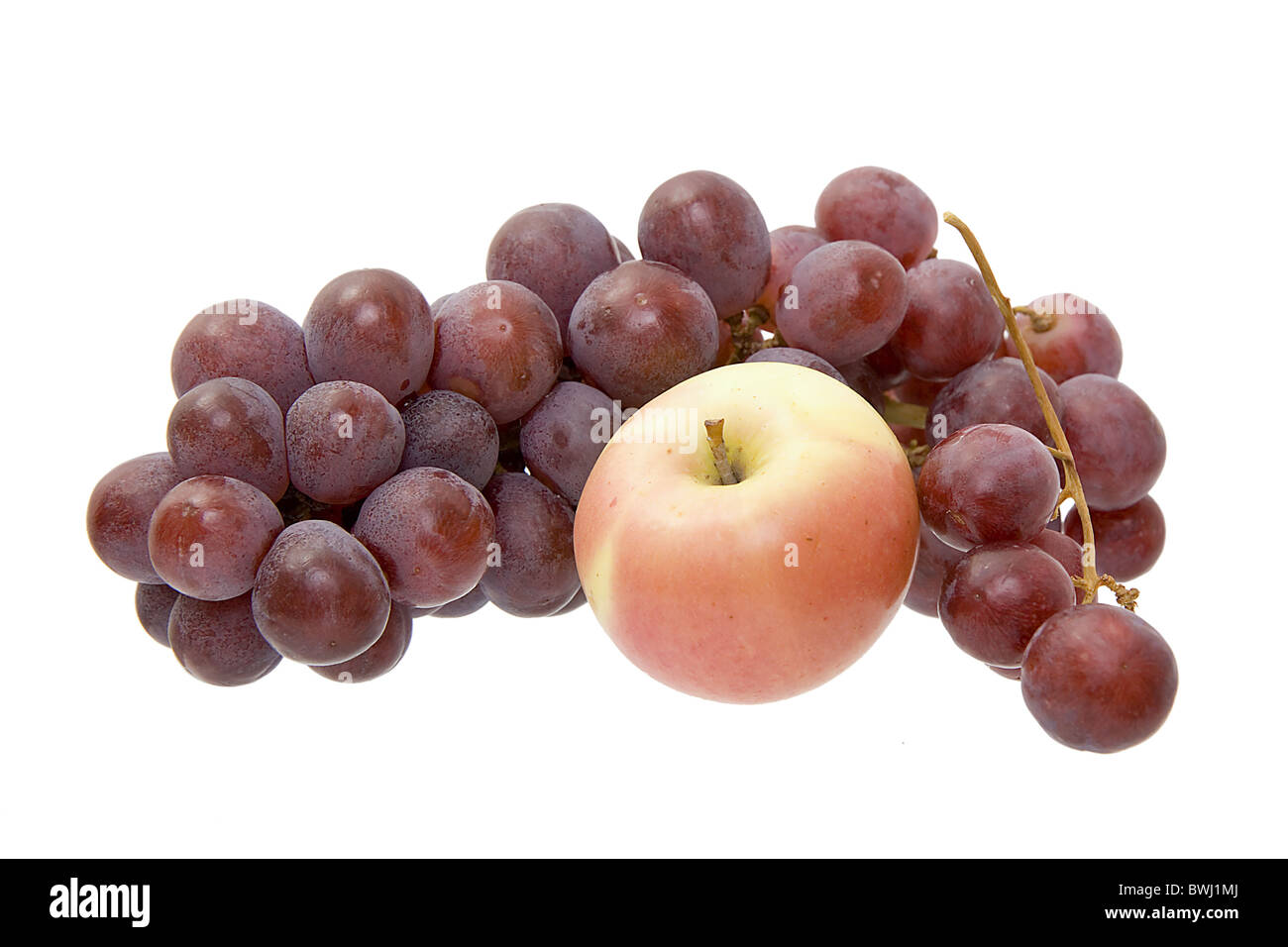 Apple and dark grapes on a white background Stock Photo - Alamy